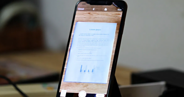 How do I scan a document on iPhone and upload it to my computer?